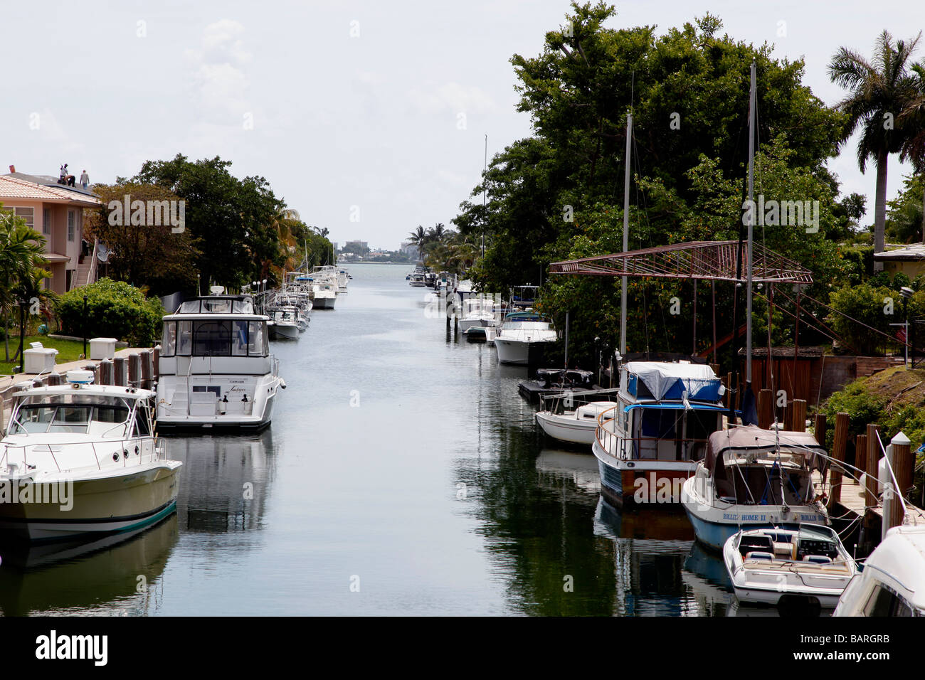 Florida Canal with boats moored Stock Photo - Alamy