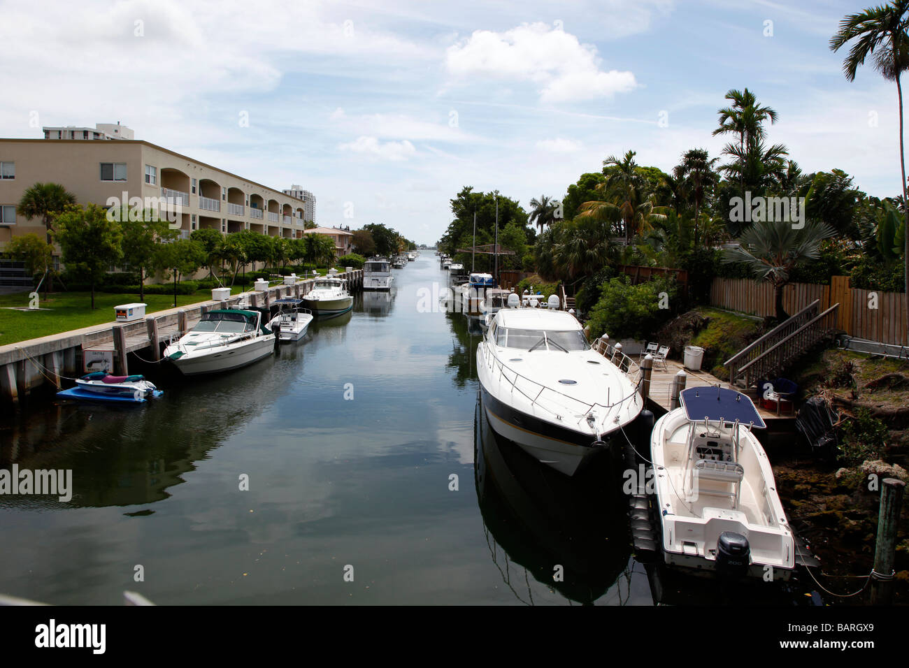Florida Canal with boats moored Stock Photo - Alamy