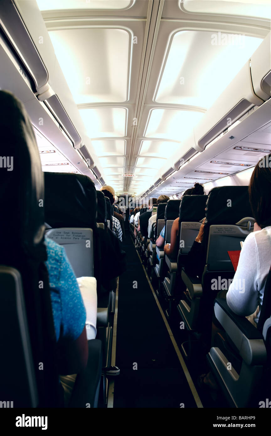 Passengers onboard an airplane Stock Photo - Alamy