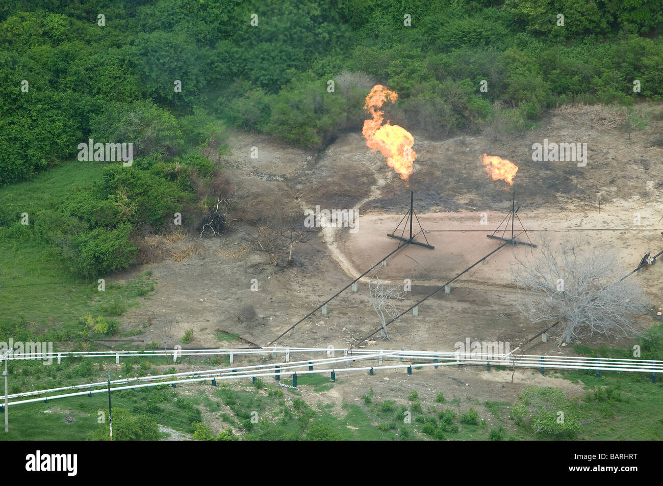 aerial view above PEMEX natural gas tranmission pipelines flare stacks ...