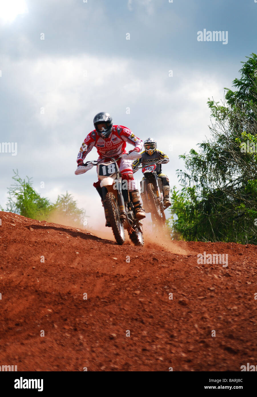 Motocross riders Jumping Stock Photo - Alamy