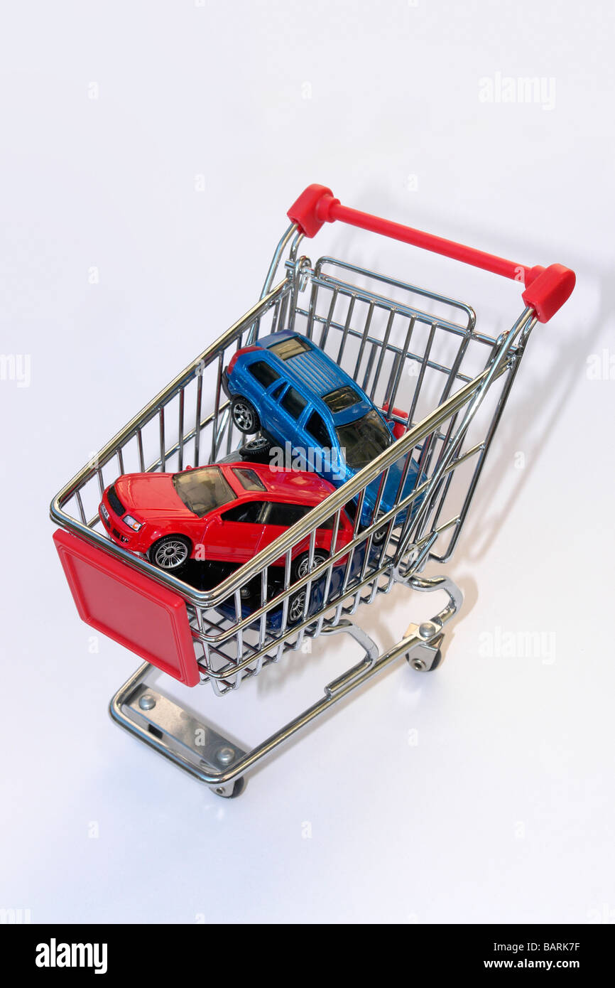 Toy cars in miniature shopping trolley Stock Photo - Alamy