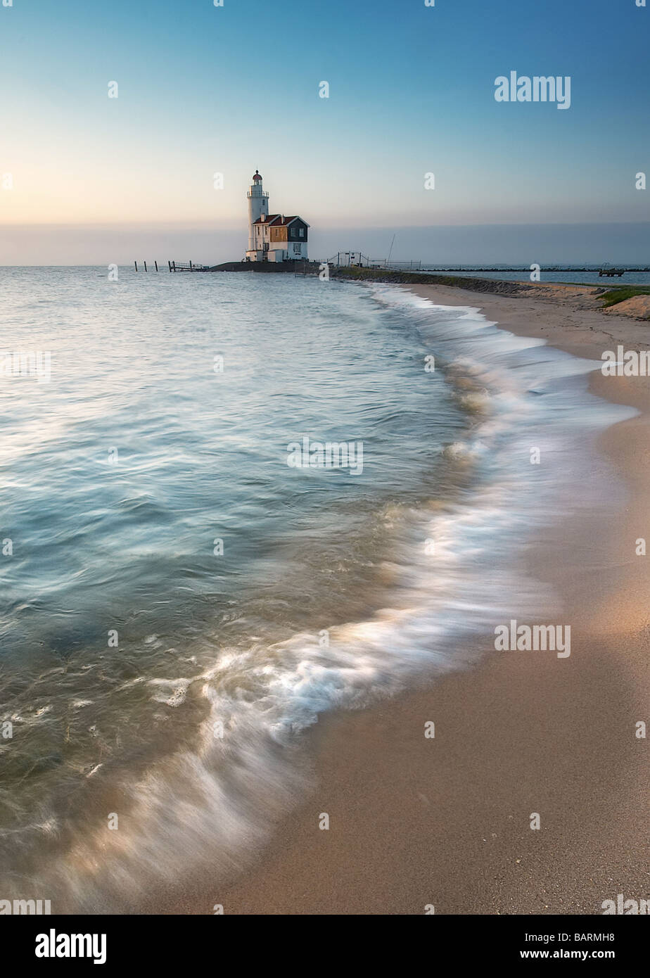 A beautiful beach and lighthouse in Marken Holland The Netherlands ...