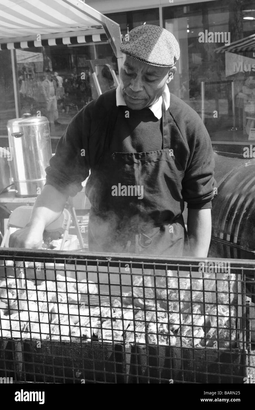 Black Male man cooking on barbeque Stock Photo - Alamy