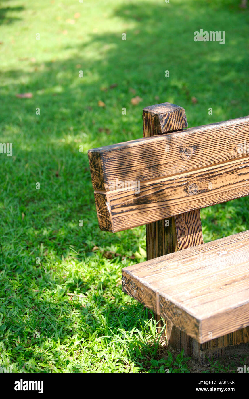 Wooden bench on lawn Stock Photo - Alamy