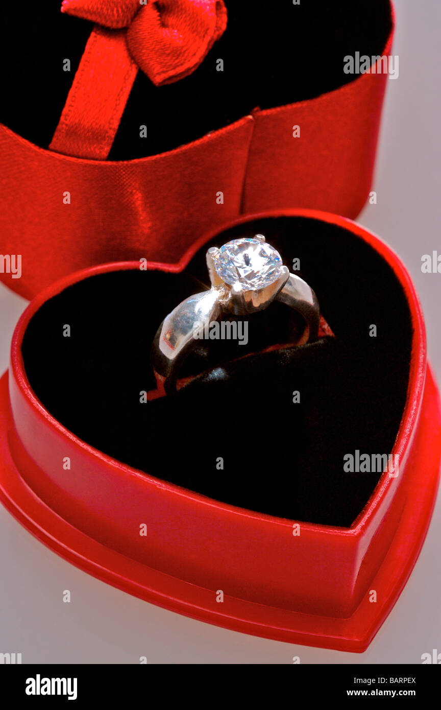 Diamond ring in heart shaped box close up Stock Photo - Alamy