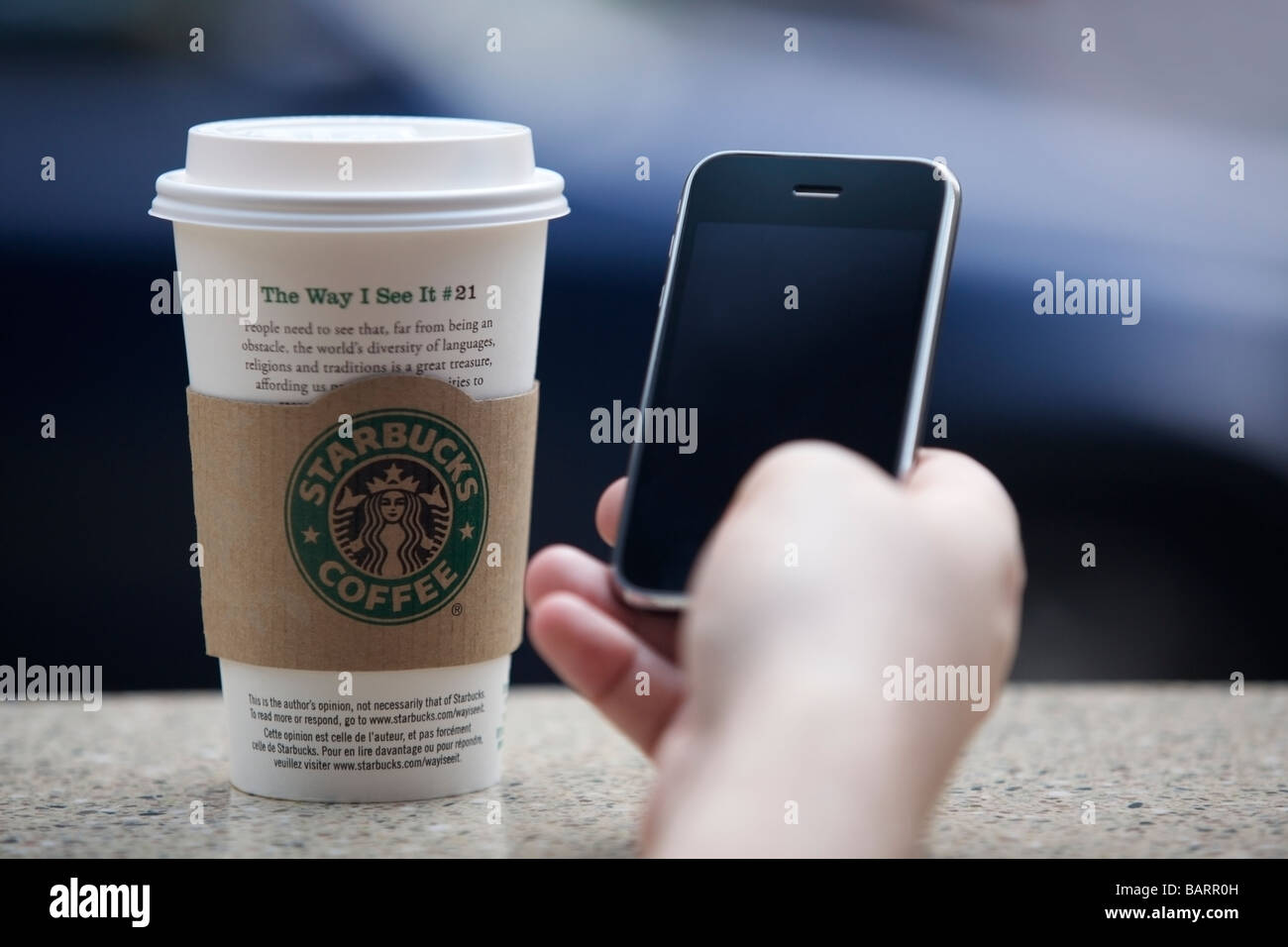 Man hand holding iPhone showing iPhone application Stock Photo - Alamy