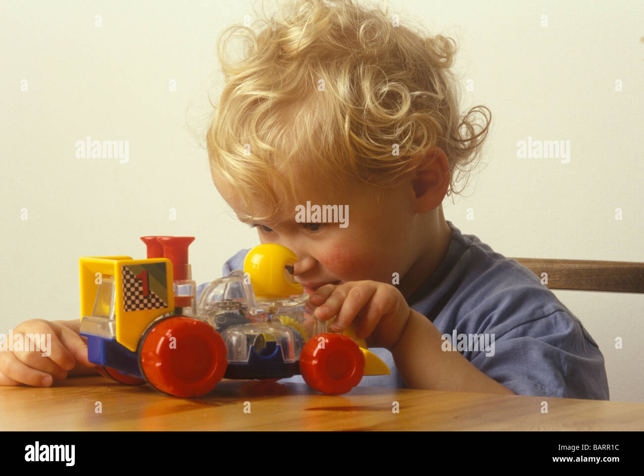 child with plasic model car Stock Photo - Alamy