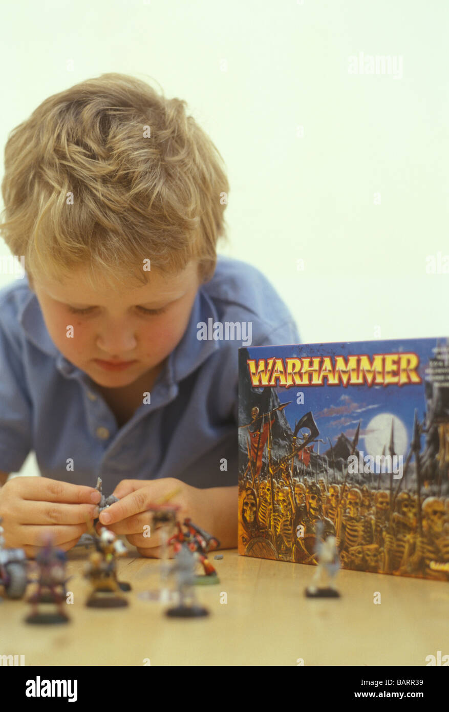 boy with small model plastic toys Stock Photo - Alamy