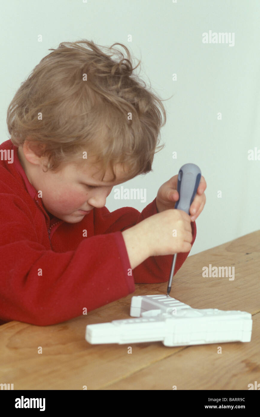 Child taking apart toy hi-res stock photography and images - Alamy