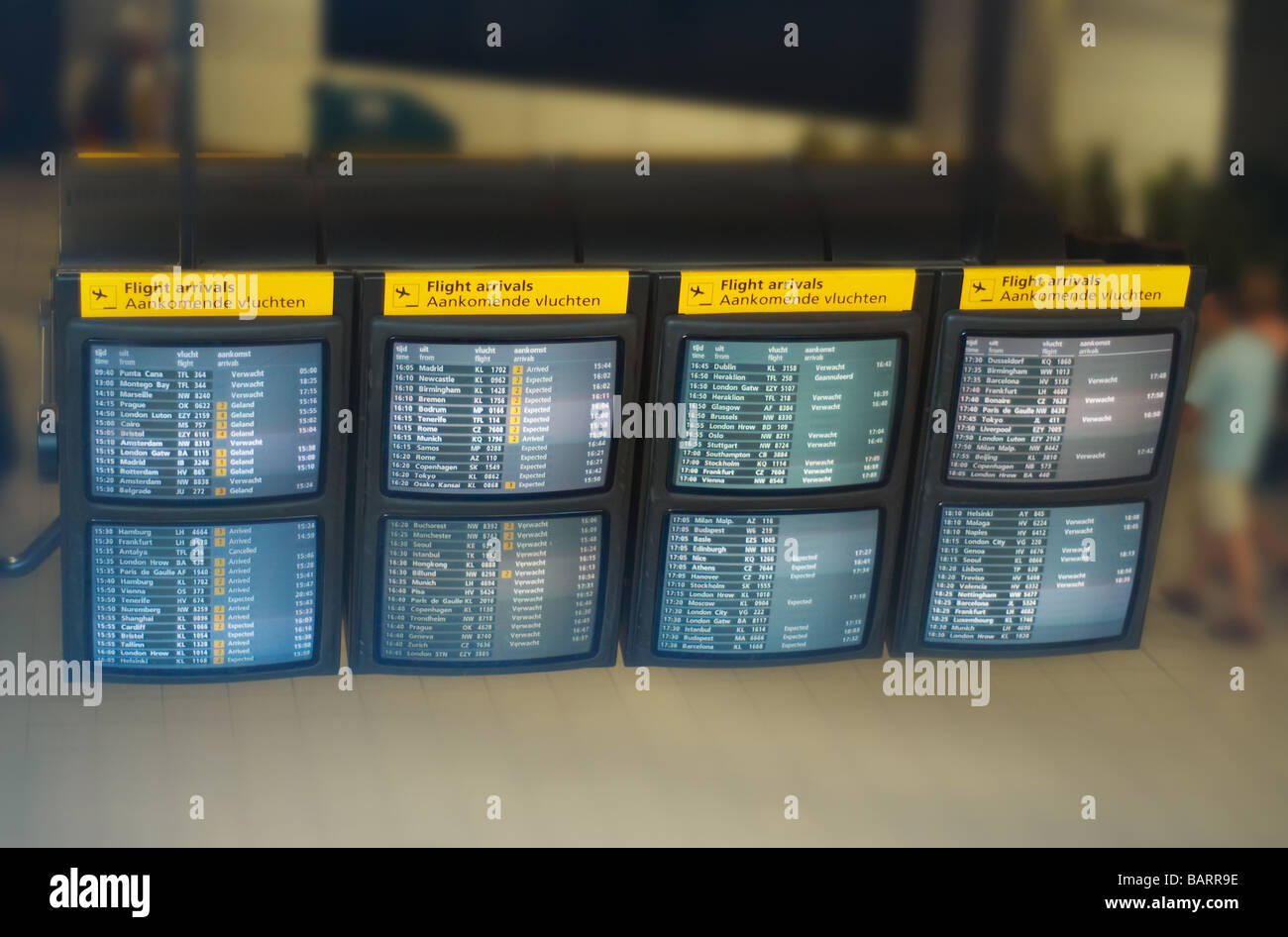 screens displaying arrival times at the airport Stock Photo - Alamy