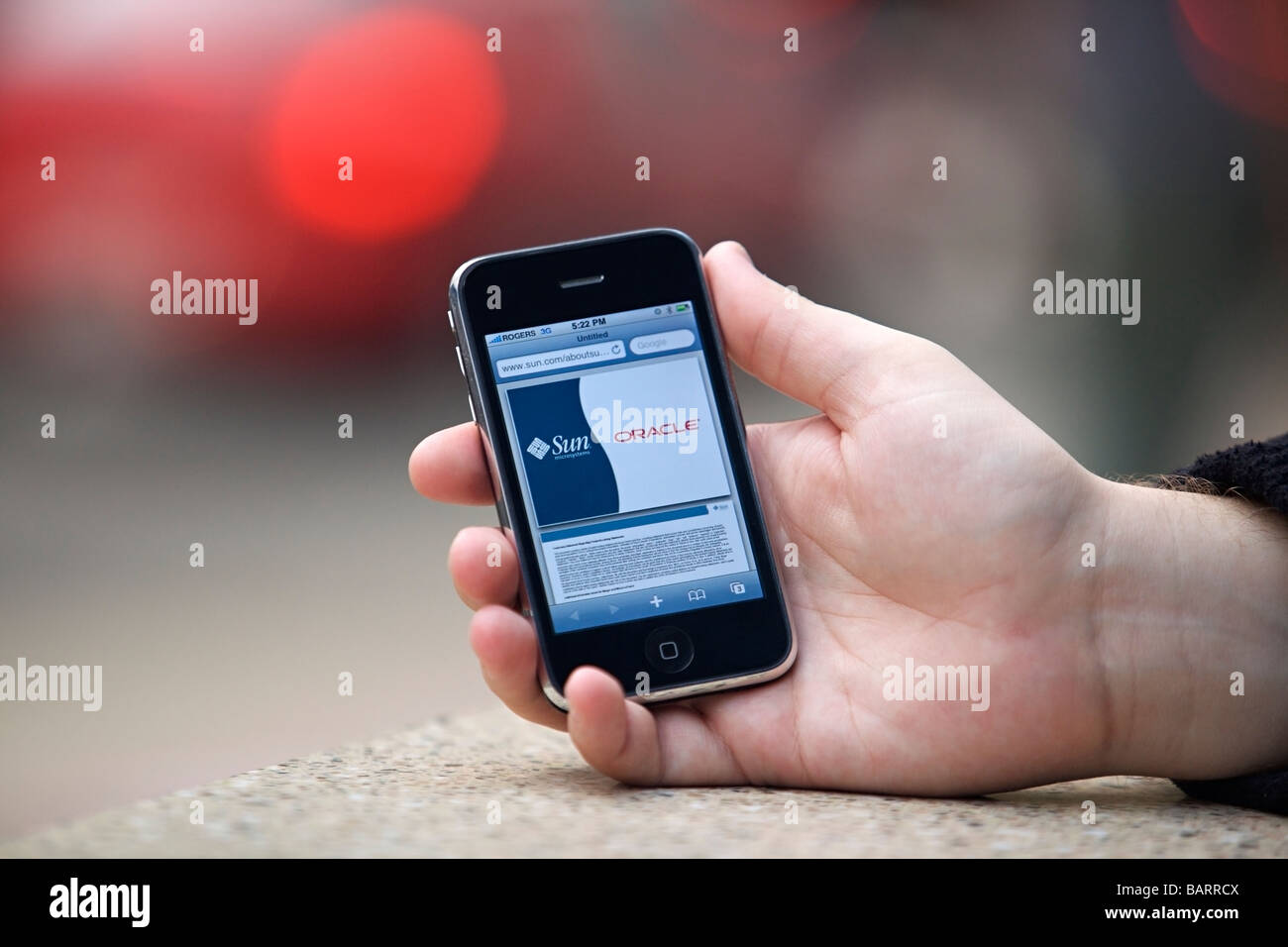 Man hand holding iPhone showing iPhone application Stock Photo - Alamy