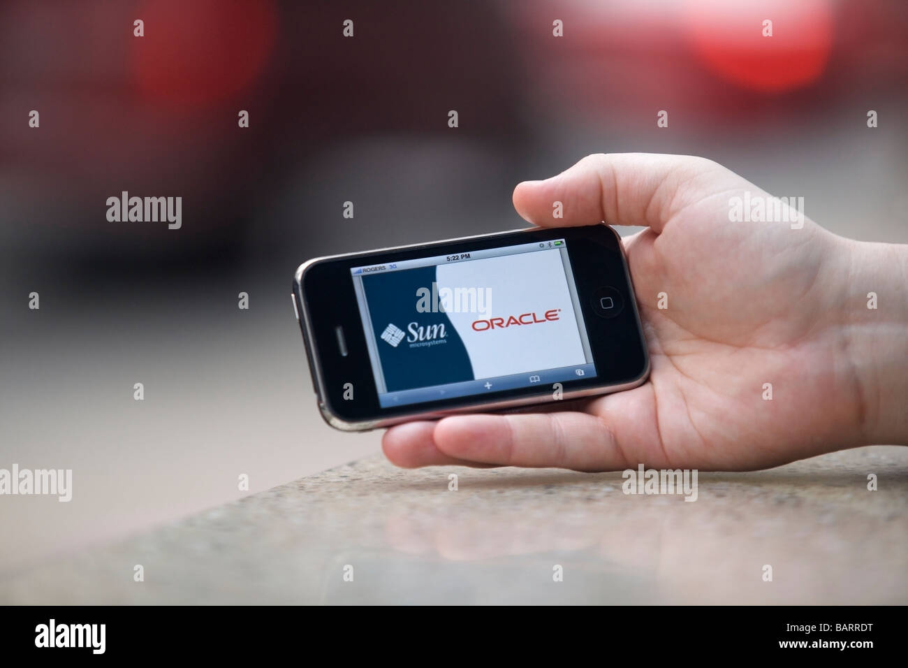 Man hand holding iPhone showing iPhone application Stock Photo - Alamy