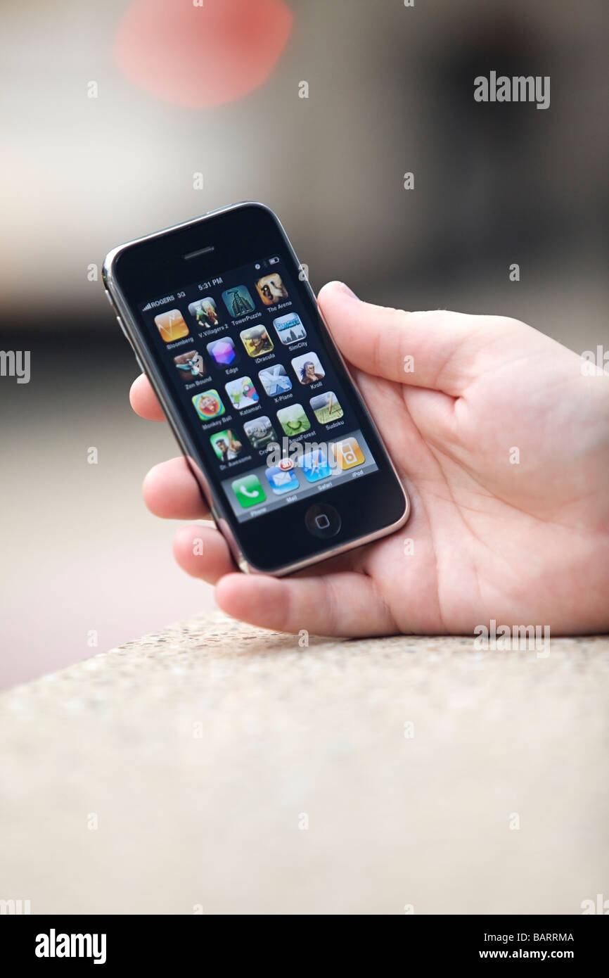 Man hand holding an iPhone Stock Photo - Alamy