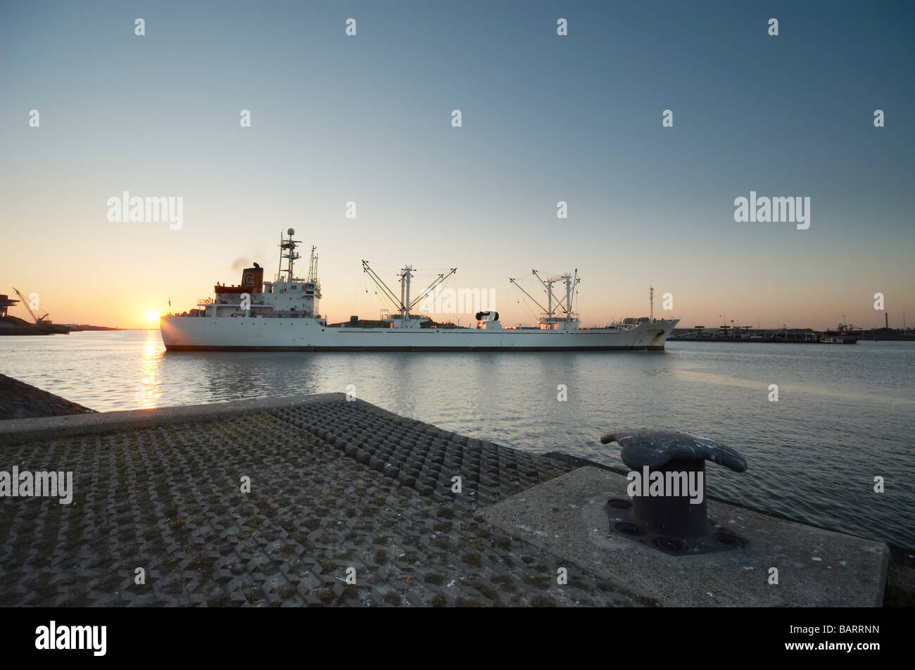 boat and sunset in harbor Stock Photo - Alamy