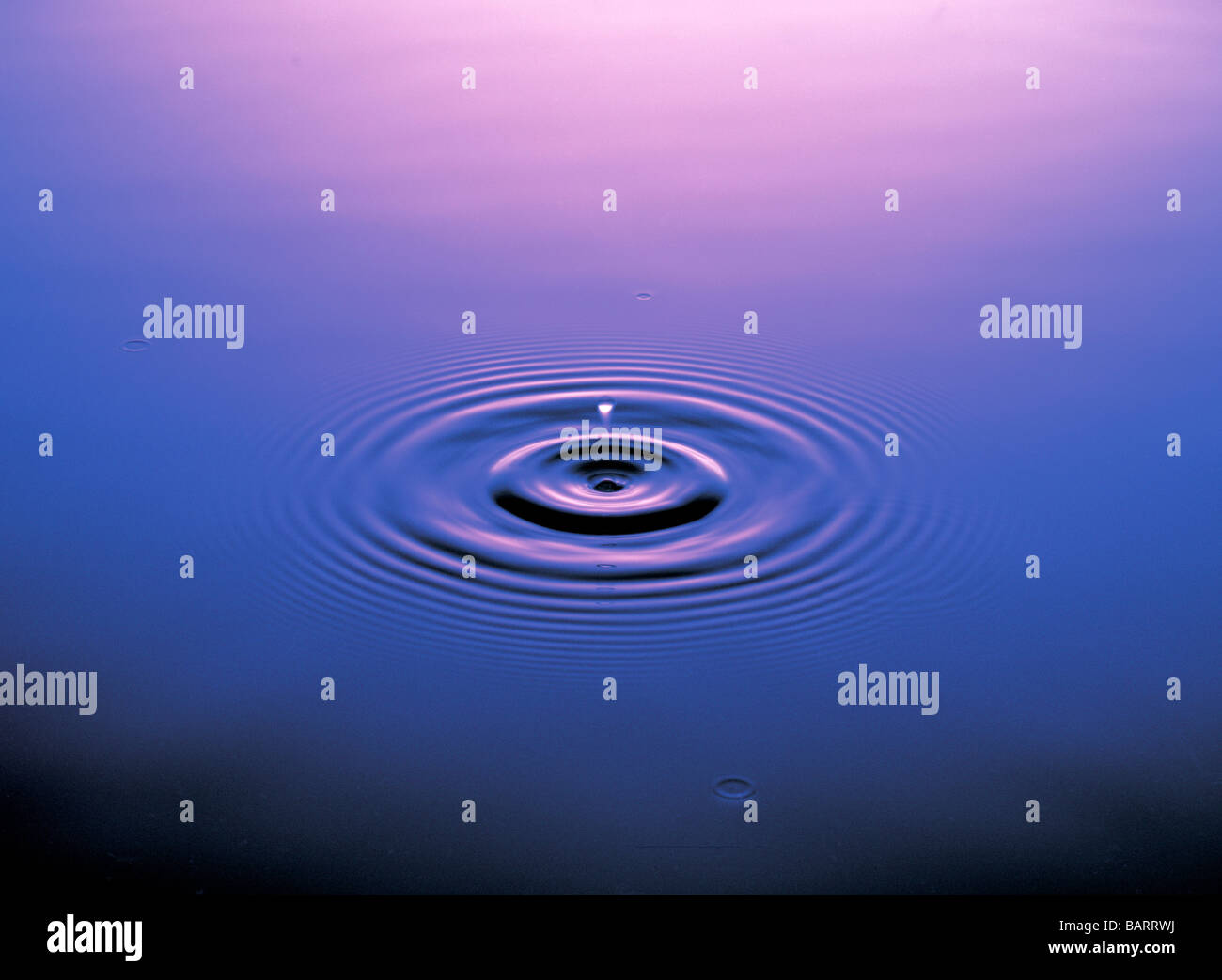 Stop action photograph of drop of water as it falls finally splashes ...