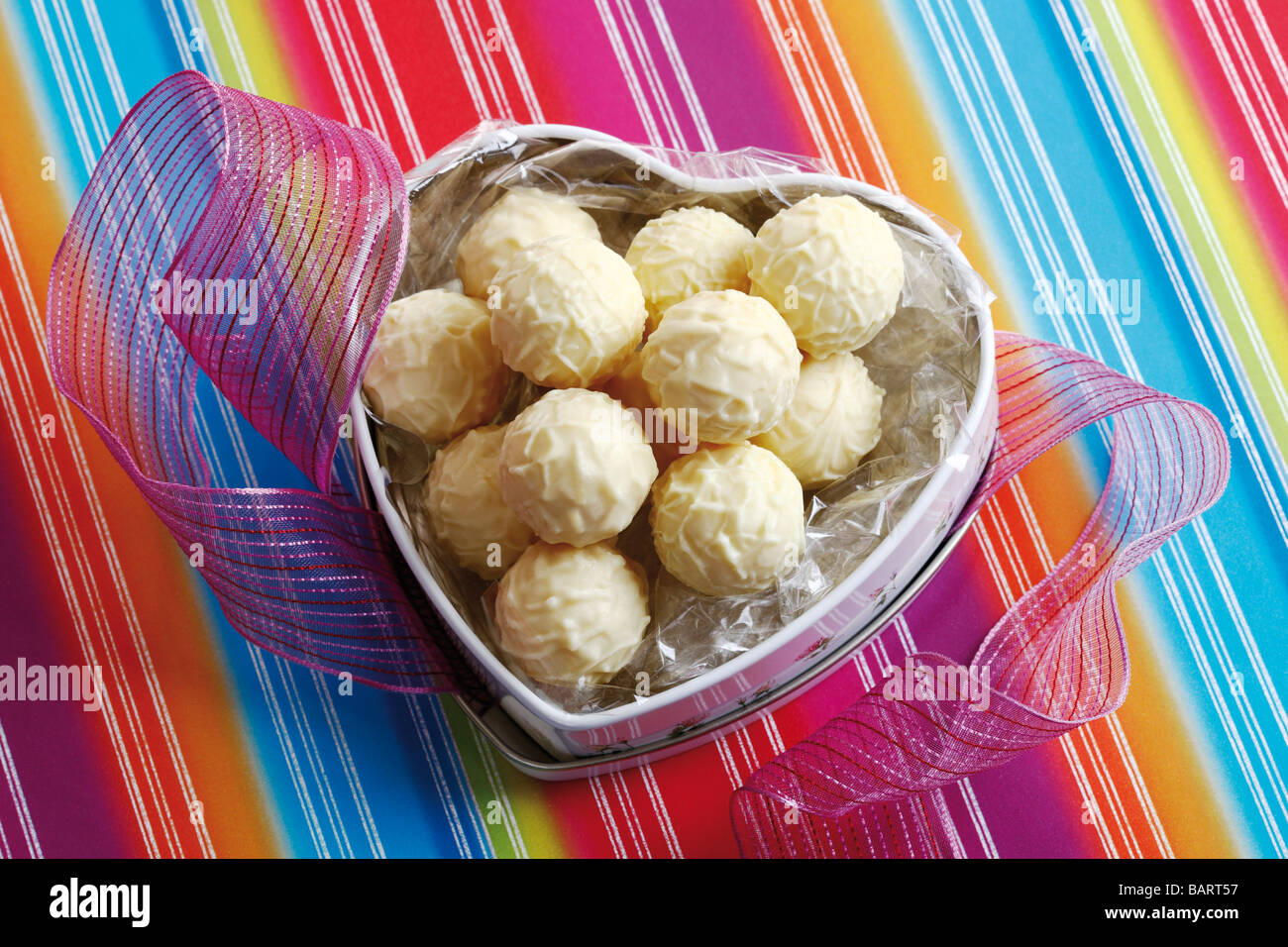 Heart-shaped candy box with pralines, elevated view Stock Photo - Alamy