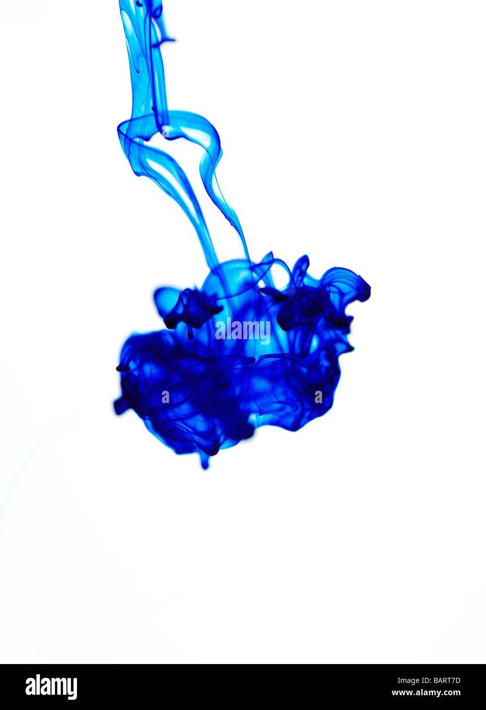 Blue dye mixing with water Stock Photo - Alamy