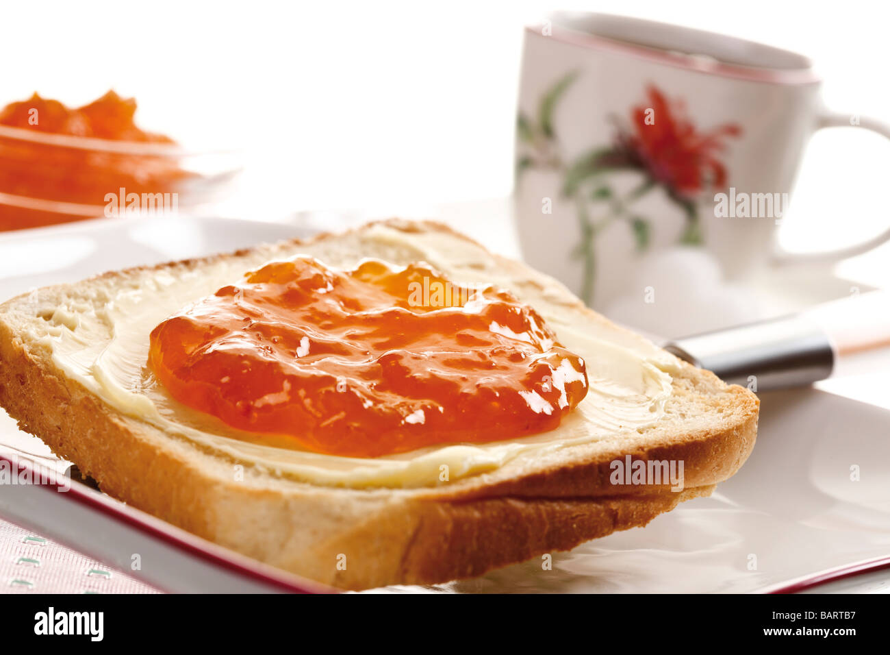 Breakfast, Slice of Toast with butter and orange jam, close-up Stock ...