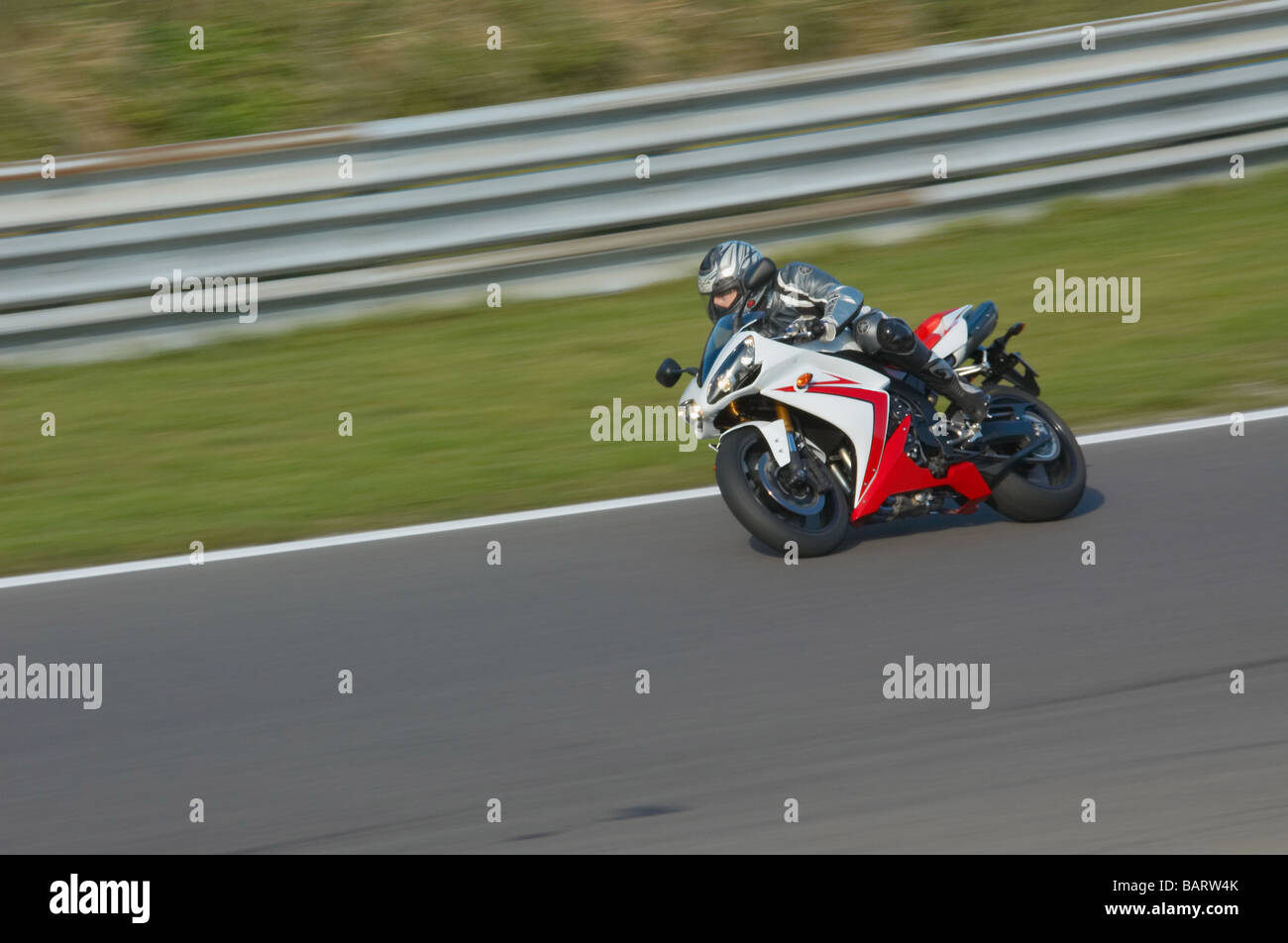 Motorbike racing in circuit Stock Photo - Alamy