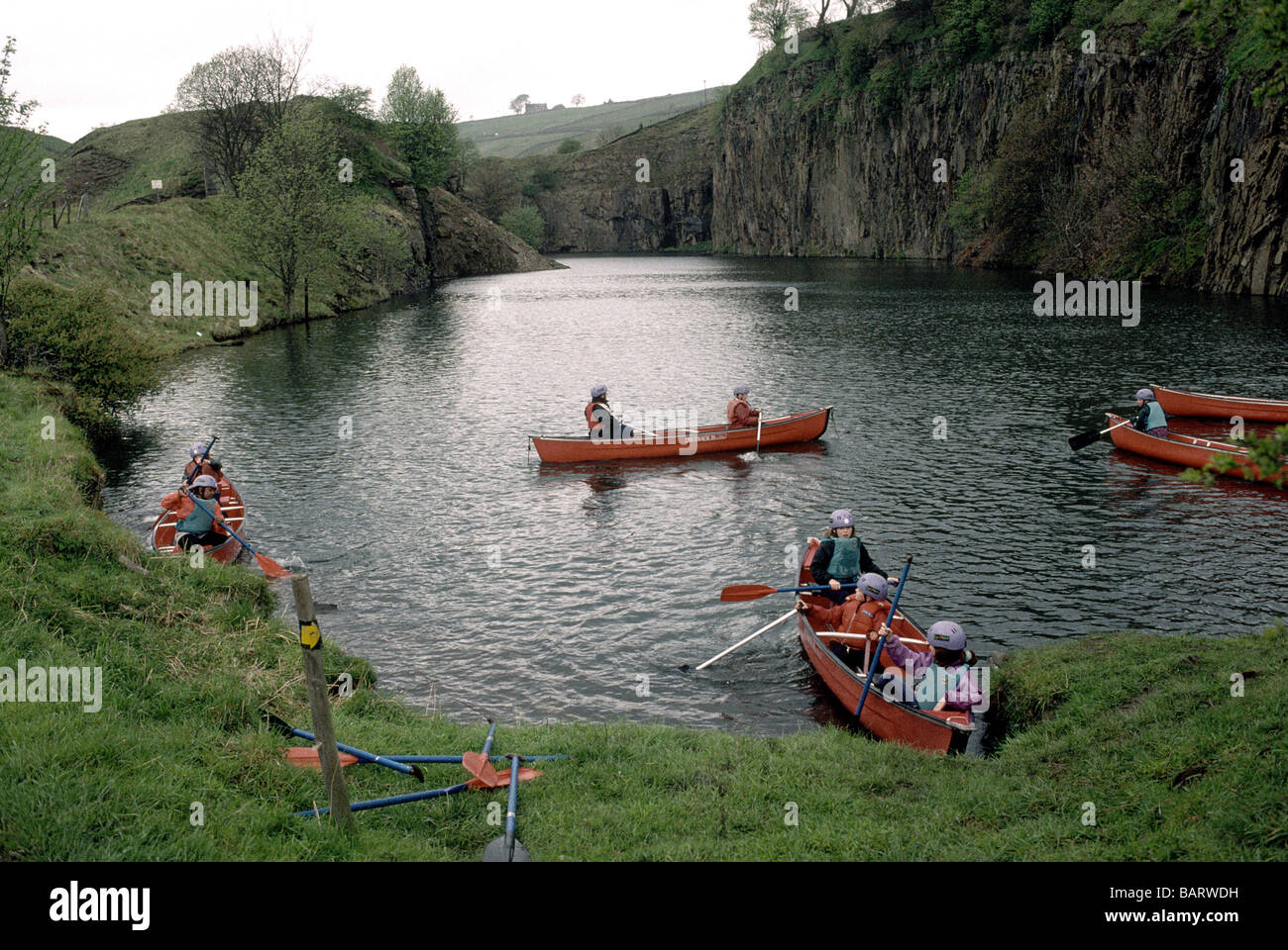 Primary school children on an adventure outing canoeing Stock Photo - Alamy