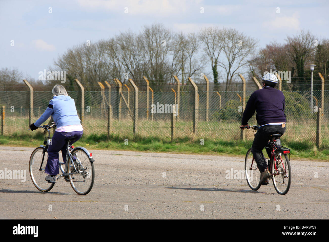 Two people cycling Stock Photo - Alamy