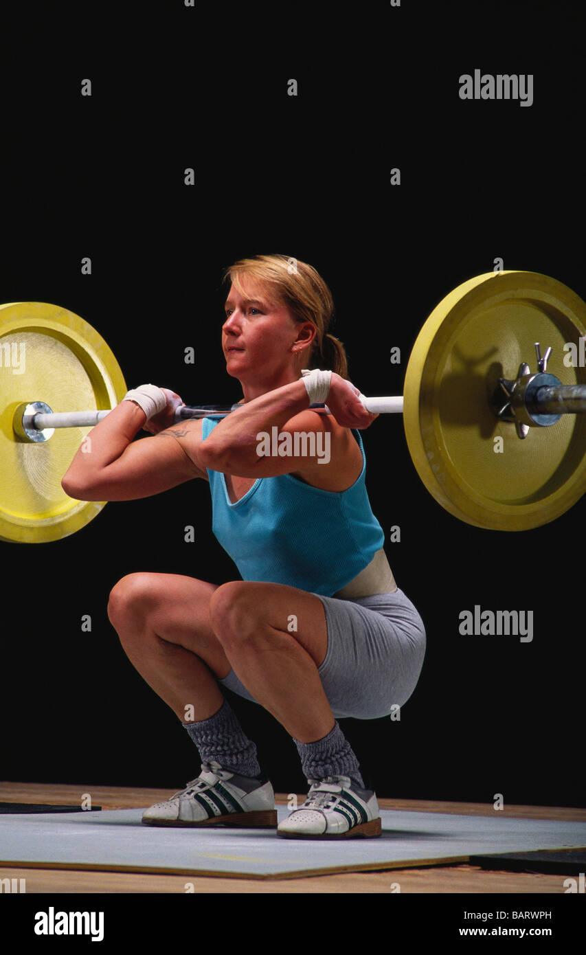 Female Olympic style weightlifter in action Stock Photo - Alamy