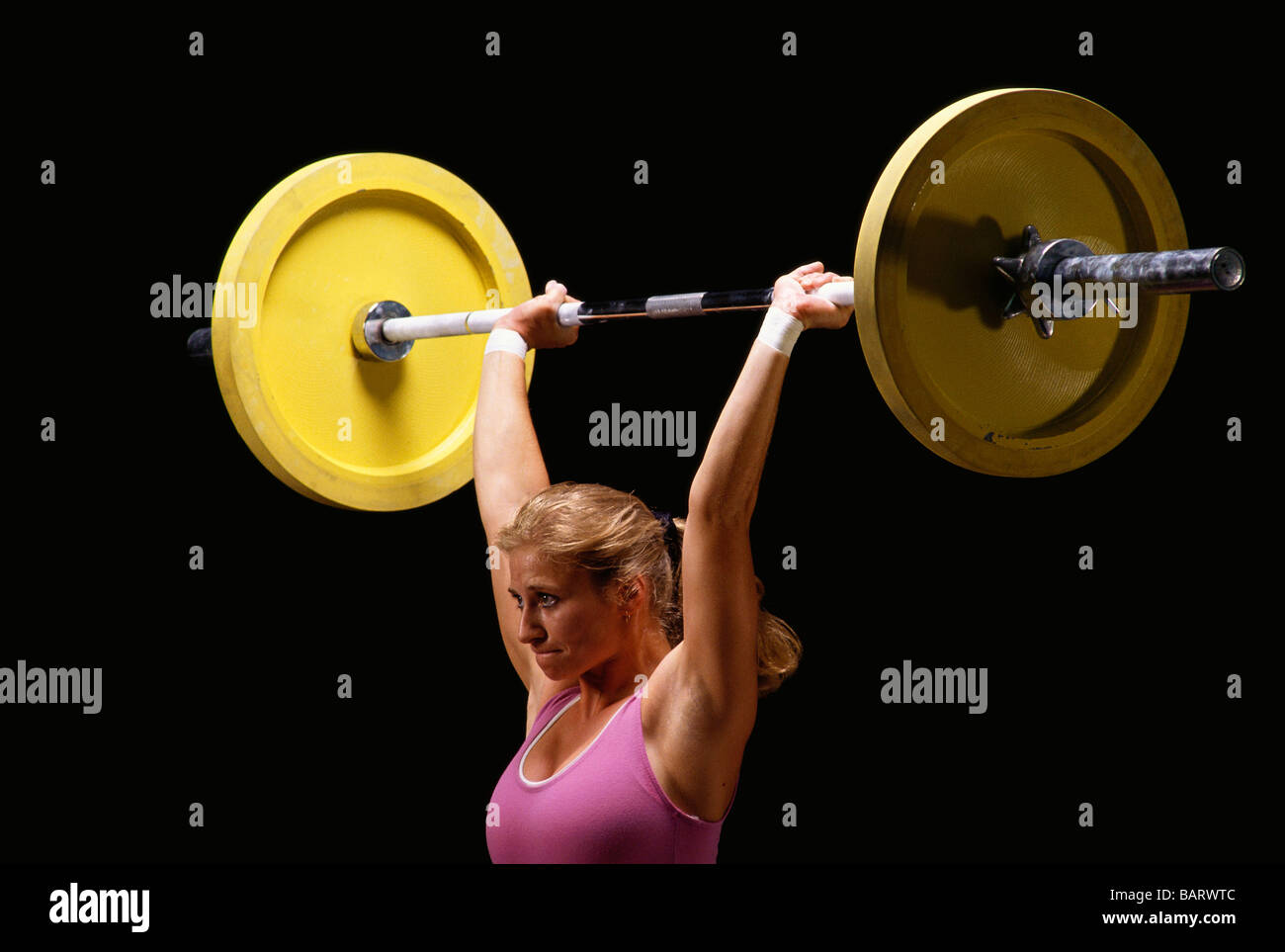 Female Olympic style weightlifter in action Stock Photo - Alamy
