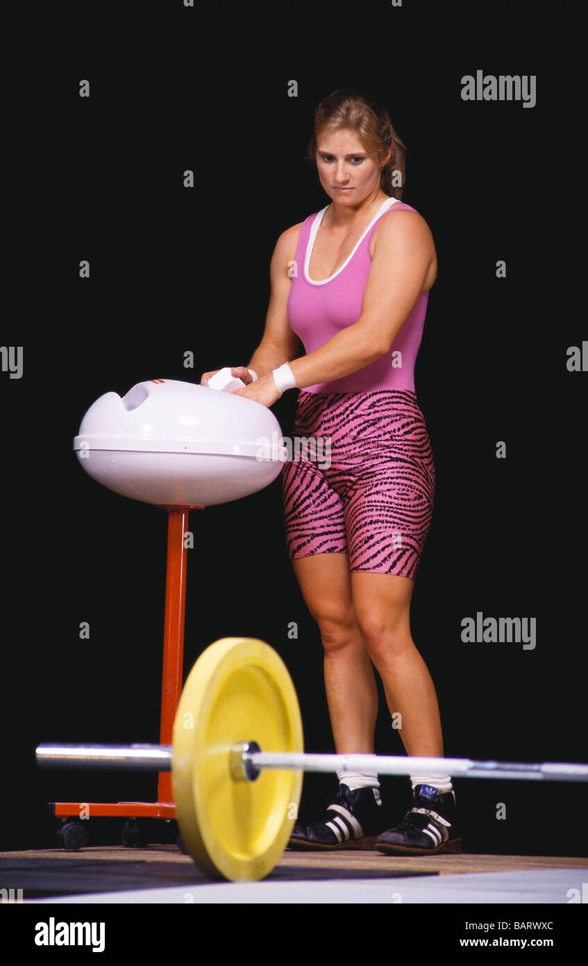 Female Olympic style weightlifter in action Stock Photo - Alamy