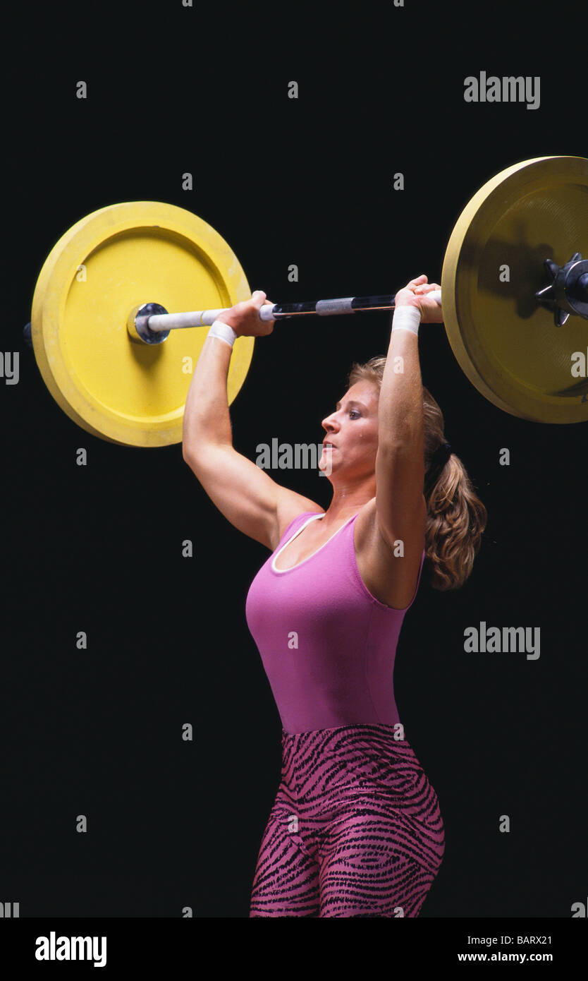 Female Olympic style weightlifter in action Stock Photo - Alamy