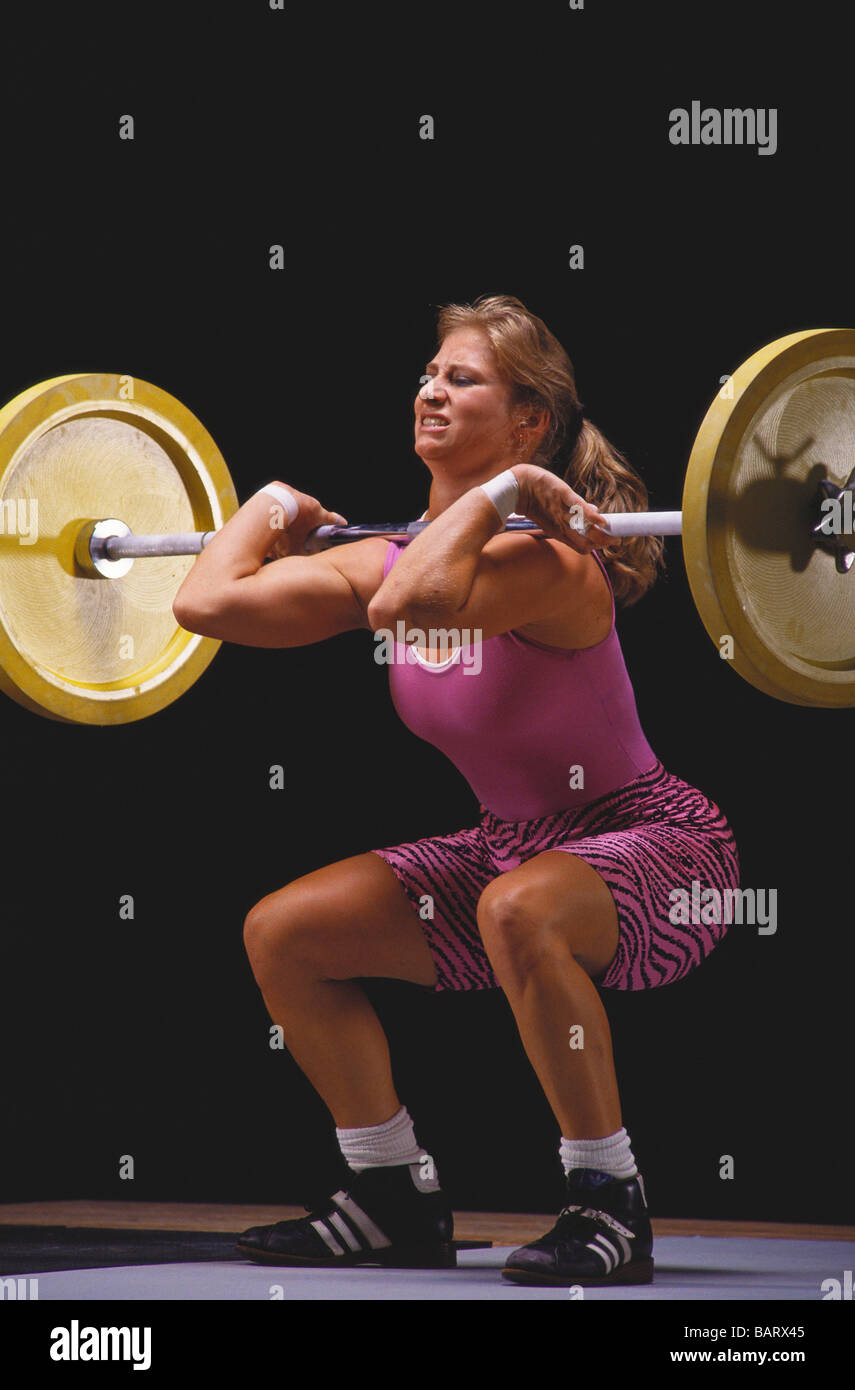 Female Olympic style weightlifter in action Stock Photo - Alamy