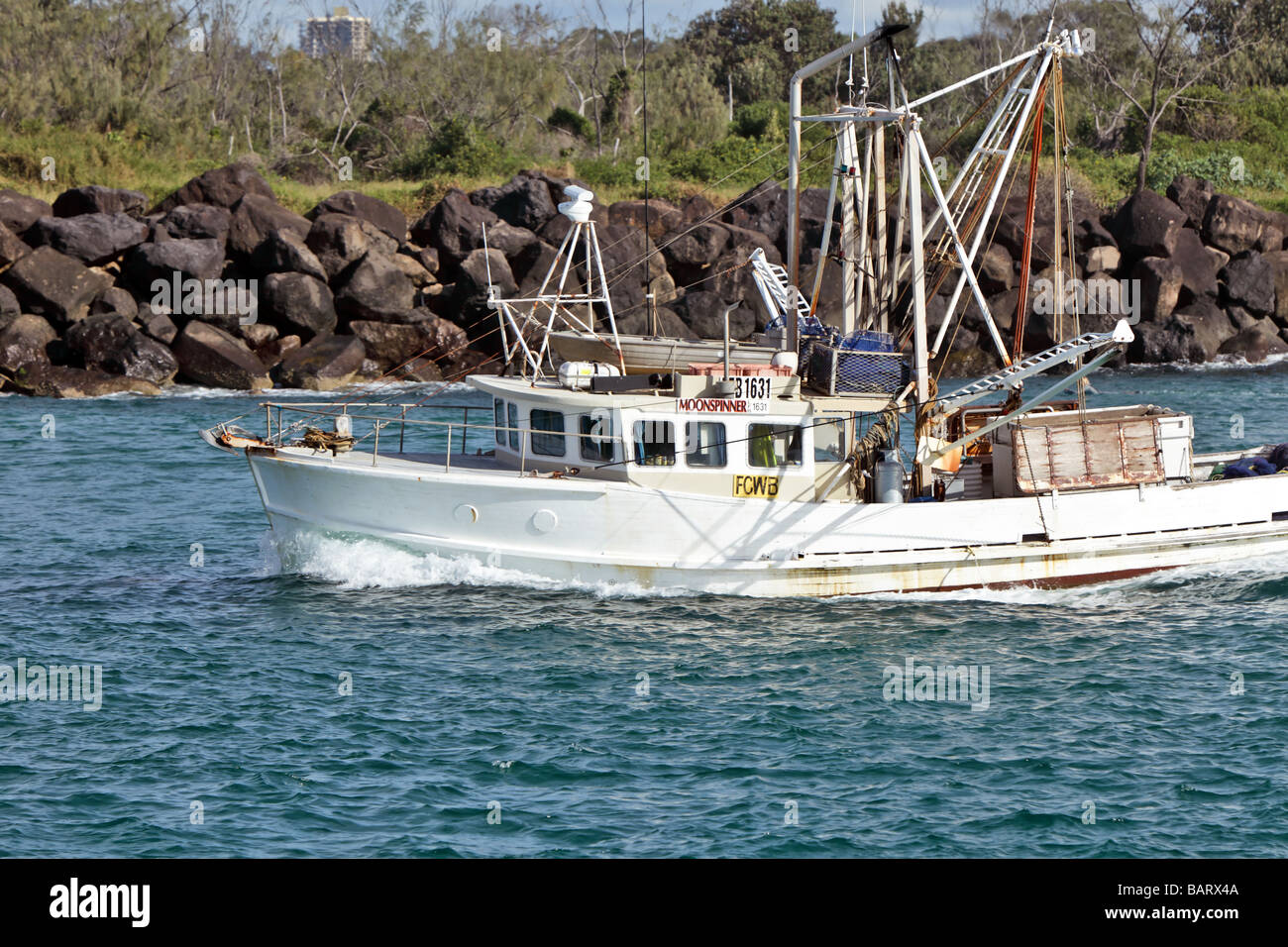 Trawler putting to sea Stock Photo - Alamy