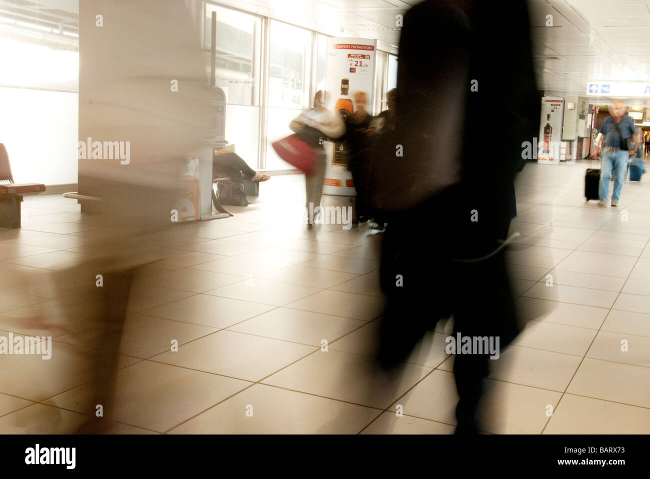 people walking through an airport Stock Photo - Alamy