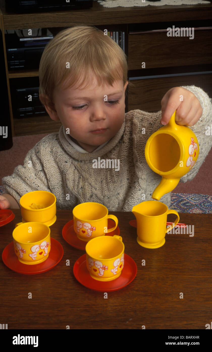 little boy playing with toy cups Stock Photo - Alamy