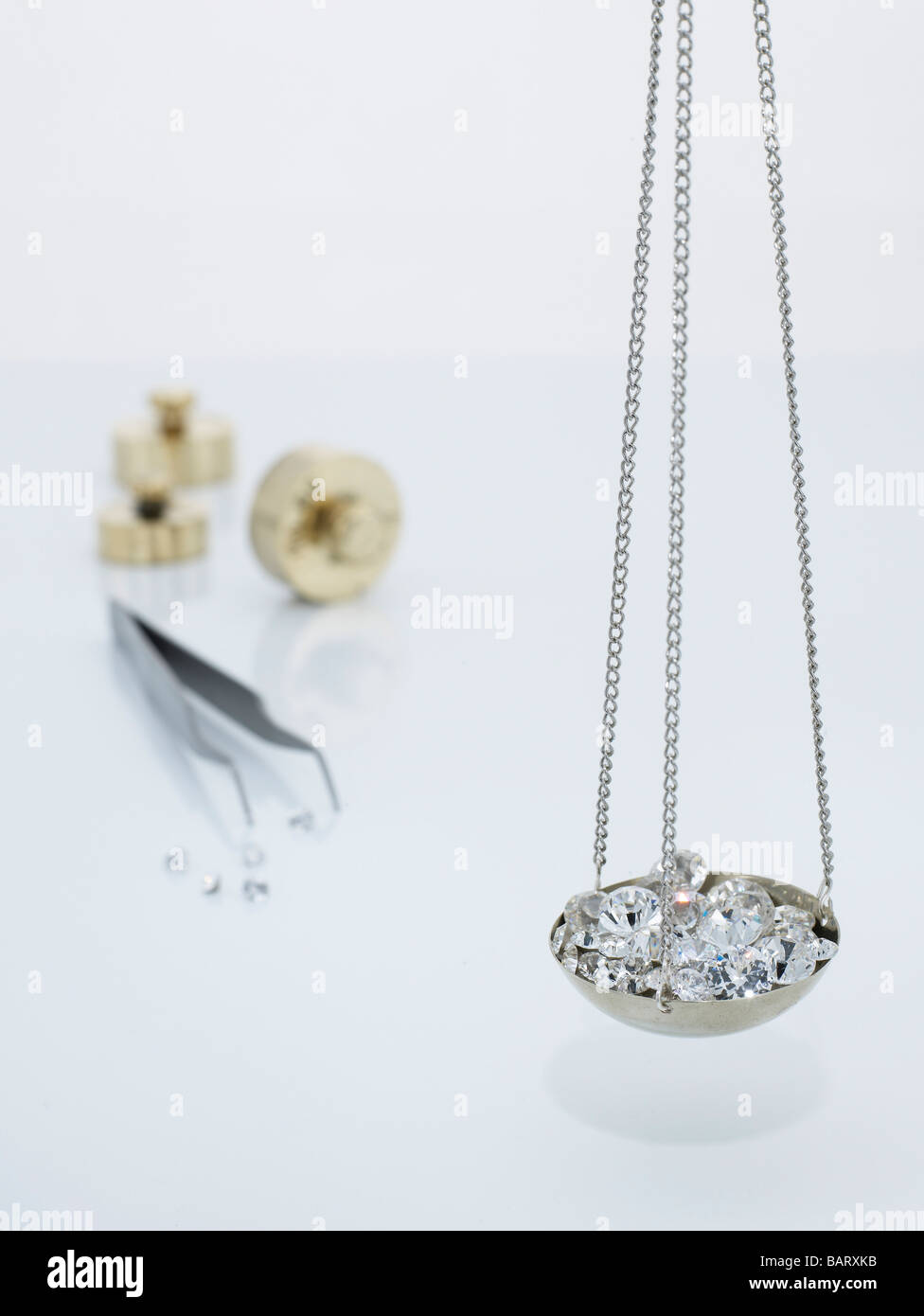Diamonds on carat scale Stock Photo - Alamy