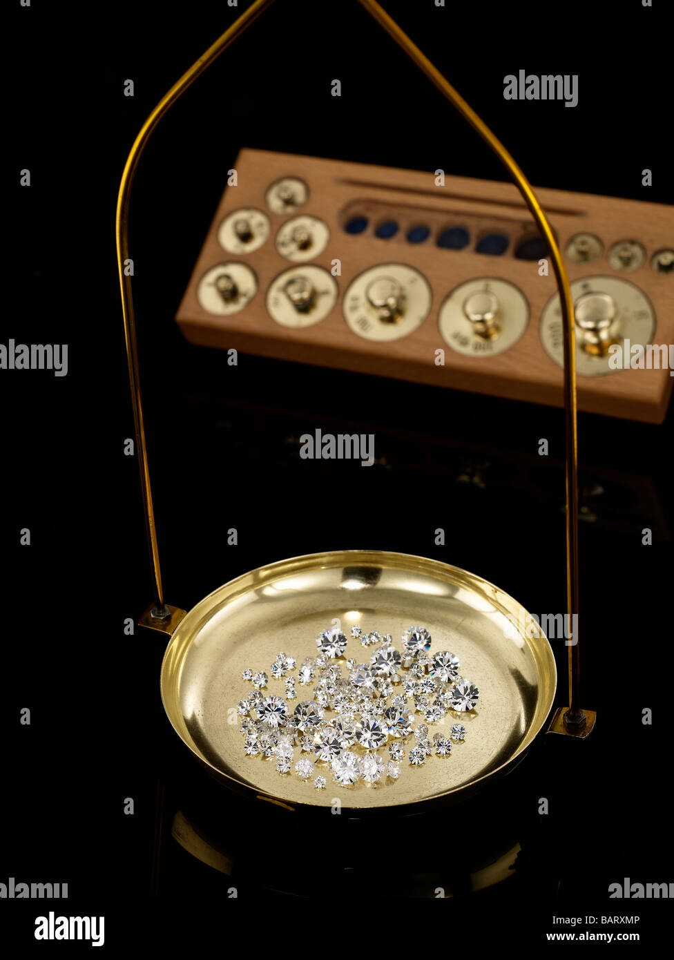 Diamonds on carat scale Stock Photo - Alamy