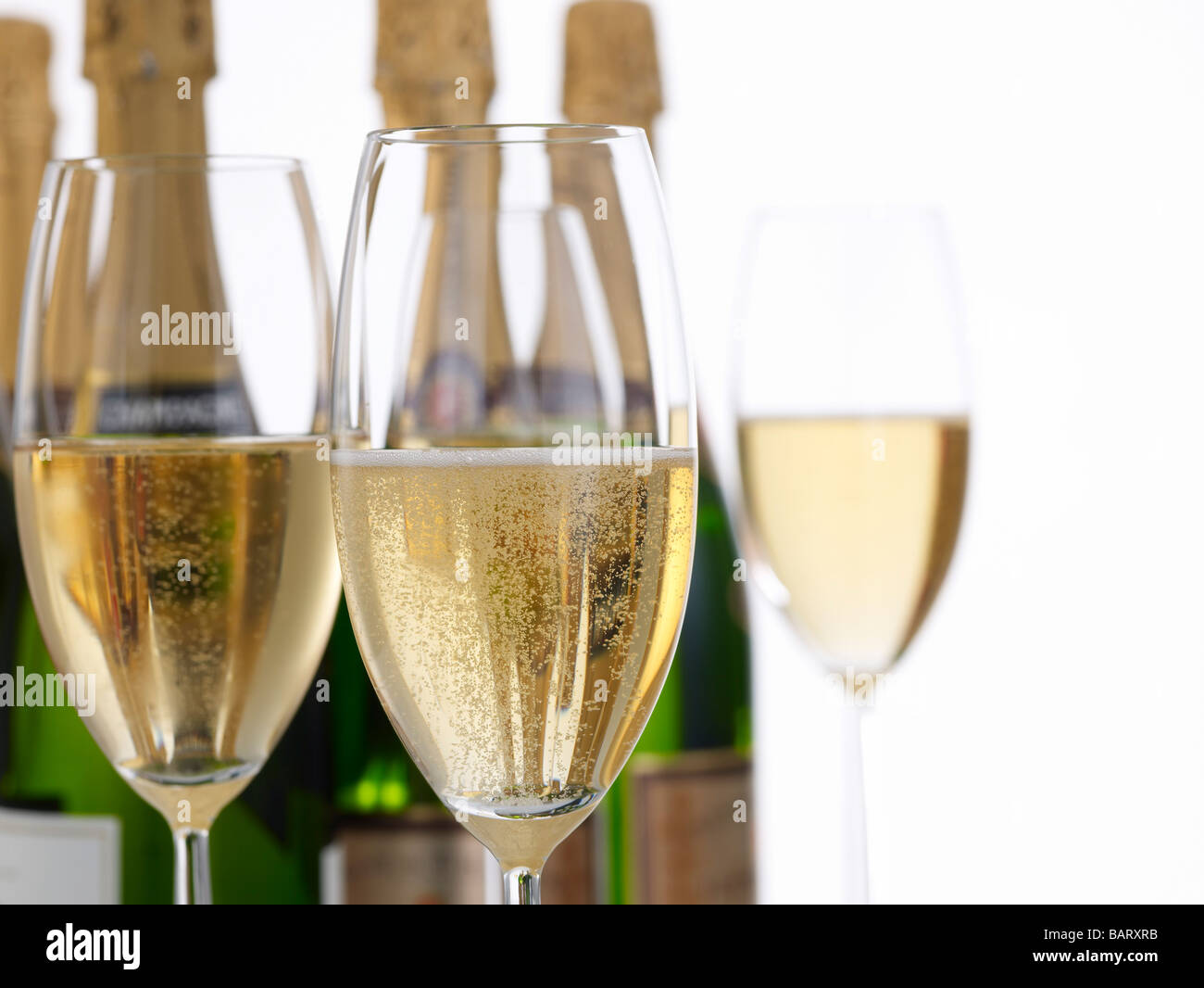 Champagne bottles and Champagne Glasses in foreground, close-up Stock ...