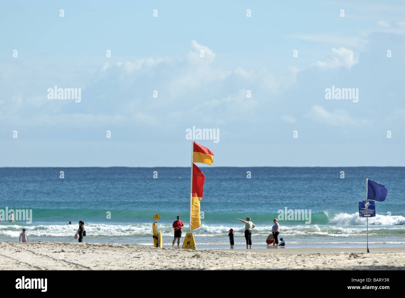 Life saving flag blowing in a breeze at the beach Stock Photo - Alamy