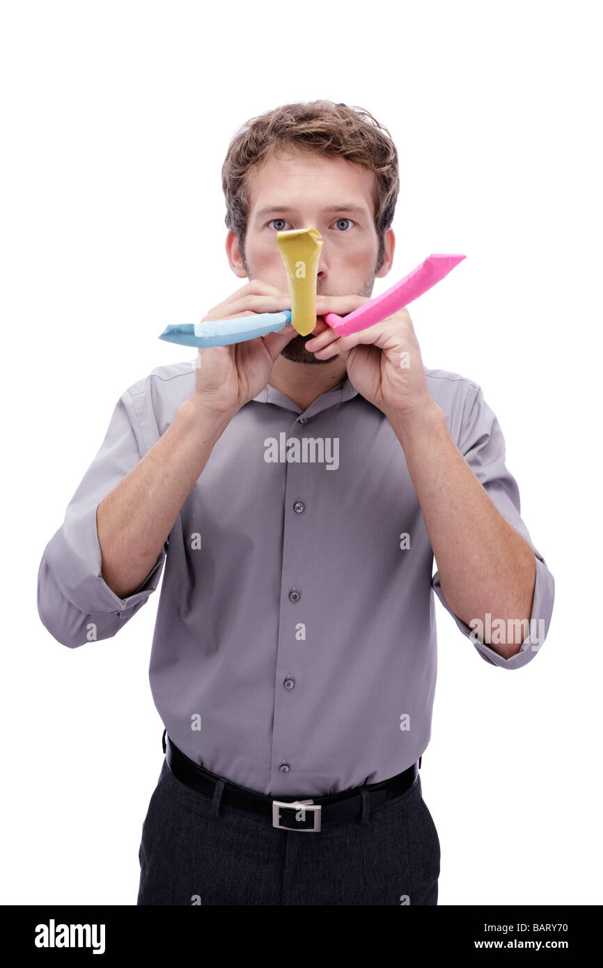 Young man party blower in mouth portrait hi-res stock photography and ...