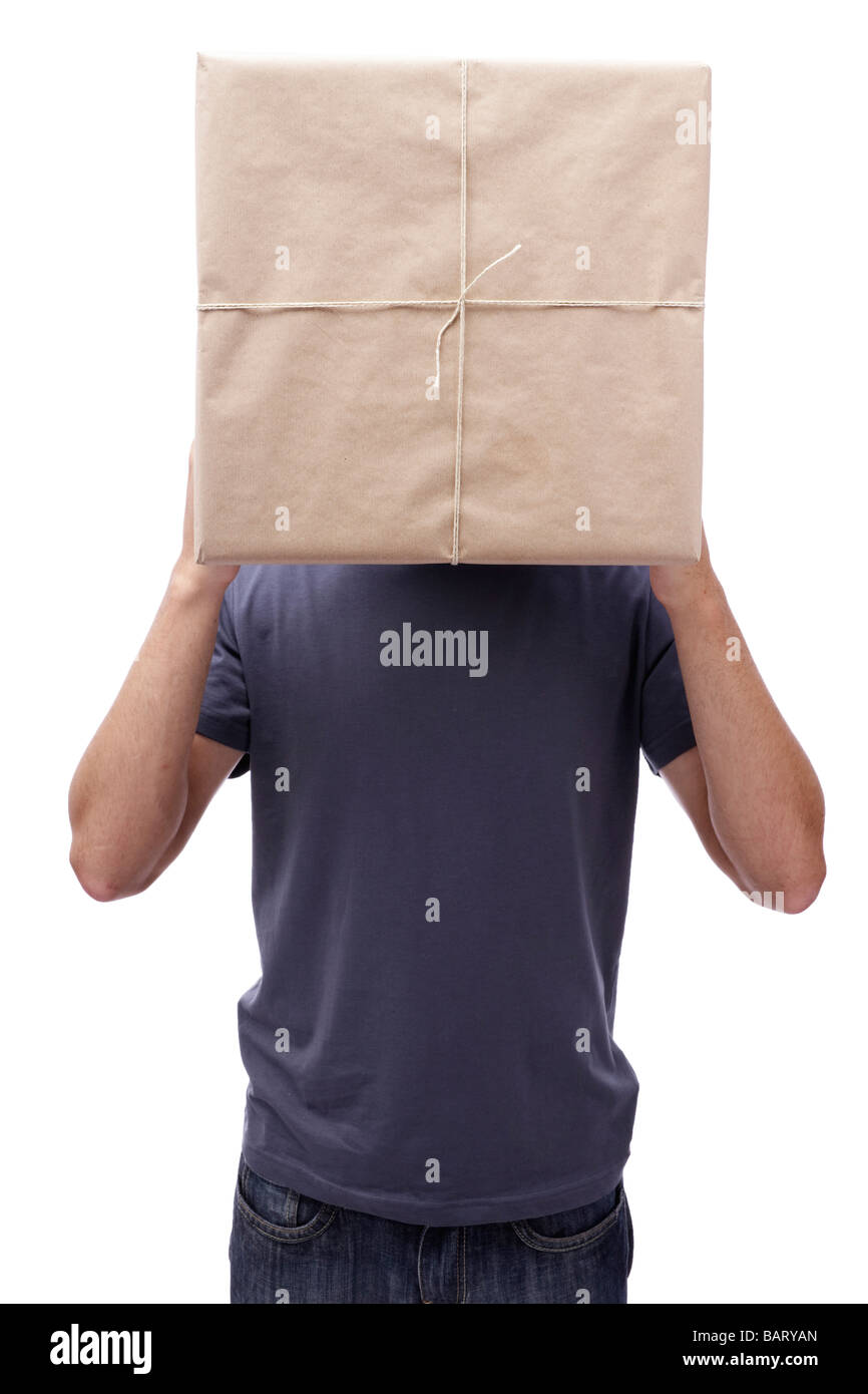 Young man holding packet, portrait Stock Photo - Alamy