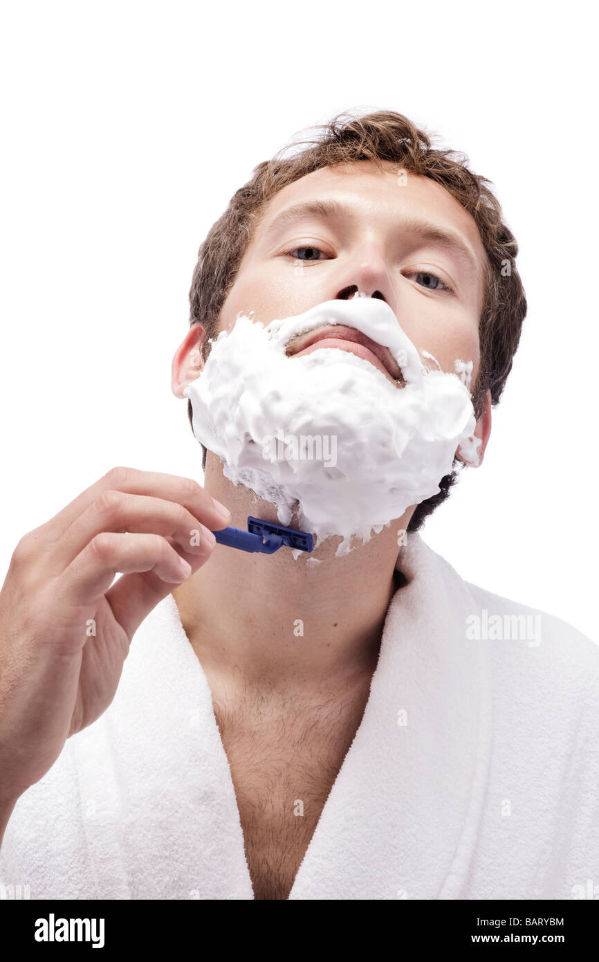Young man shaving, portrait Stock Photo - Alamy