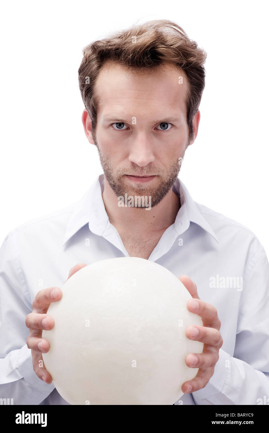 Young man with crystal ball, portrait Stock Photo - Alamy