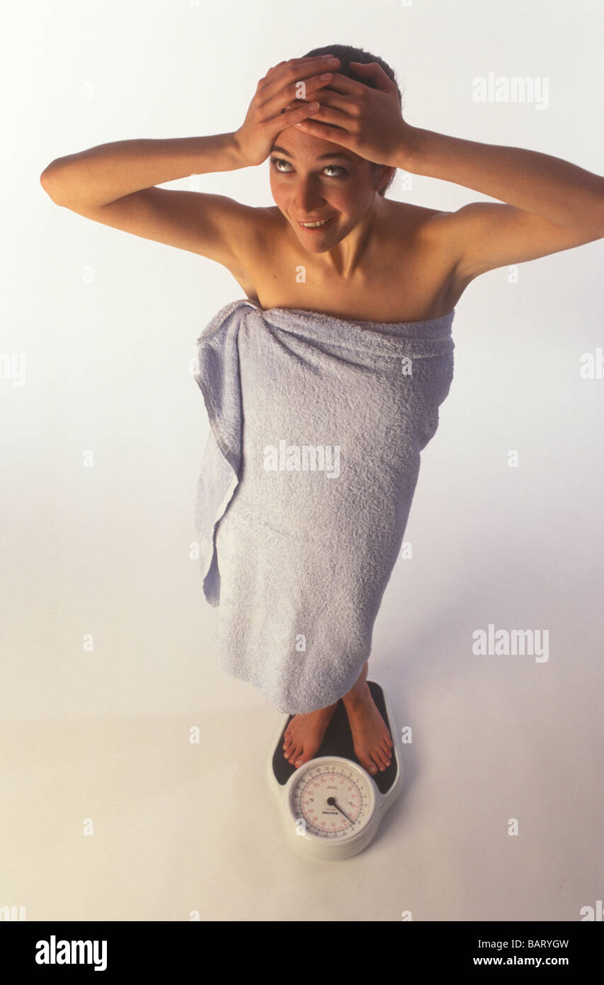 Woman weight scales shocked hi-res stock photography and images - Alamy
