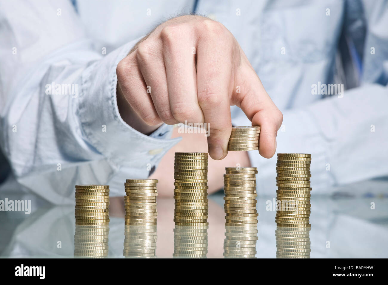 Person stacking Euro coins, close up Stock Photo - Alamy