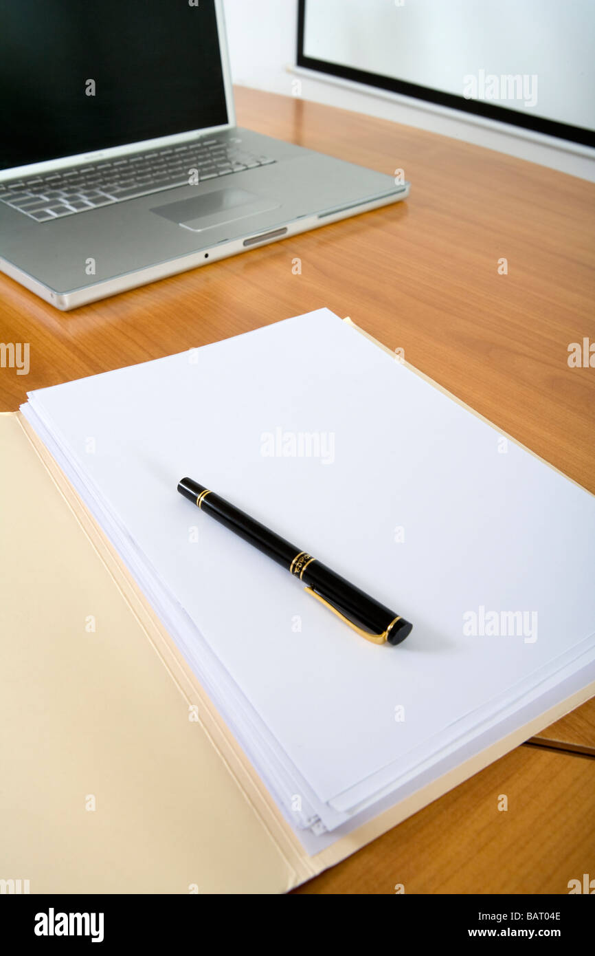 Open file on office desk Stock Photo - Alamy