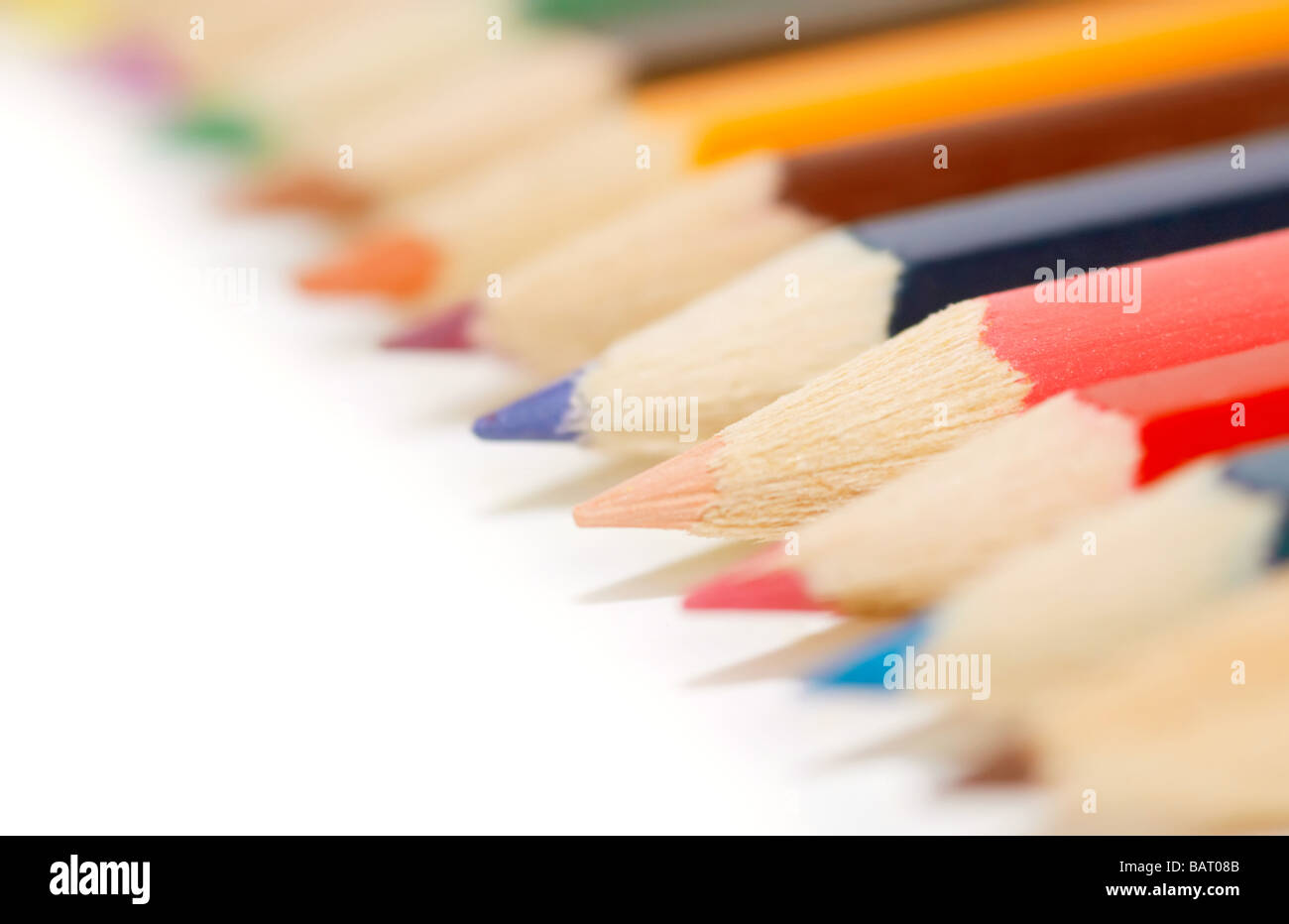 lots of colorful crayons on a white background Stock Photo - Alamy