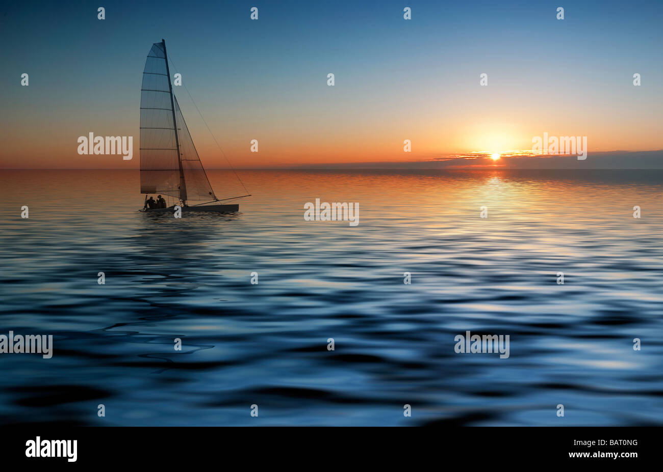 Sailing with a beautiful sunset Stock Photo - Alamy