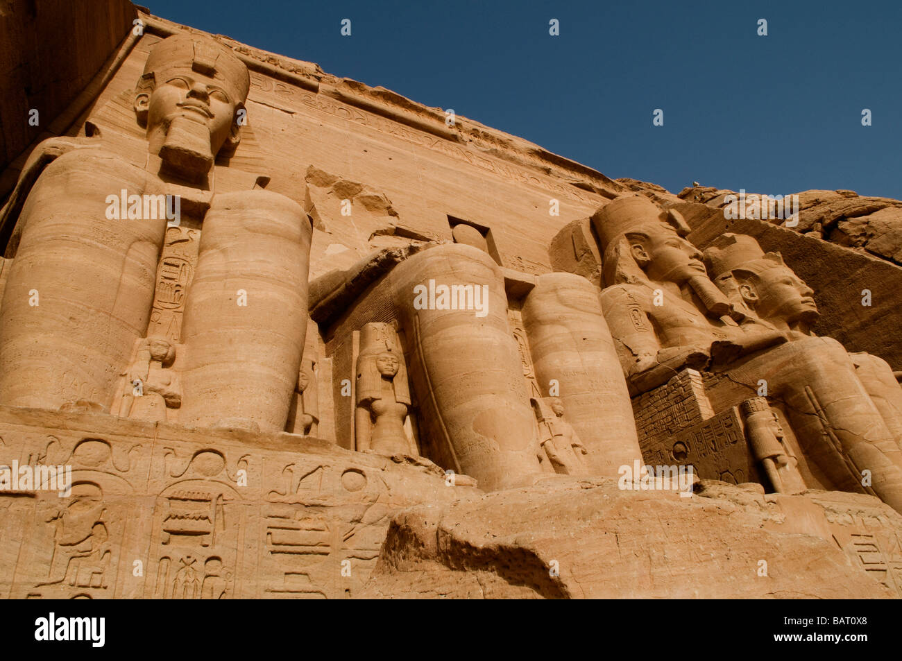 The massive four colossal statues of Pharaoh decorating entrance to the ...