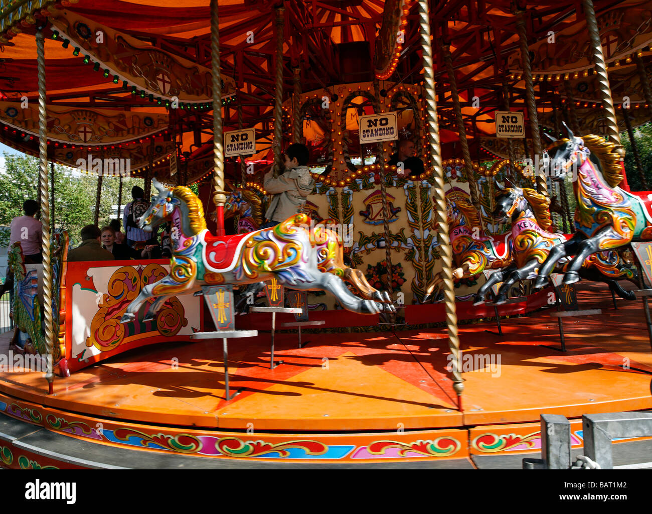 Old fashioned merry go round fair ride Stock Photo - Alamy