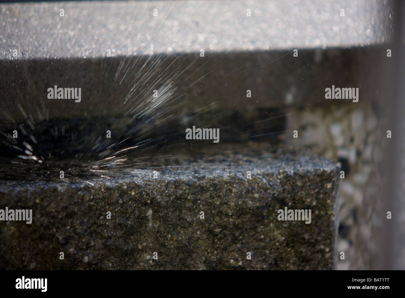 Raindrop splashes a puddle on a brick wall Stock Photo - Alamy